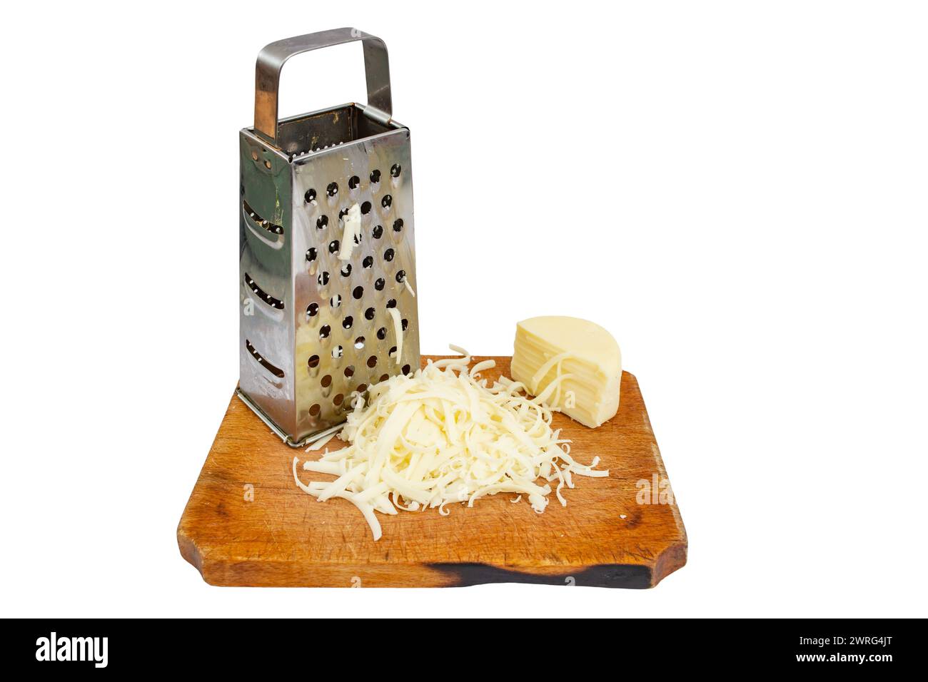 Romanian pressed cheese called cascaval, grated on a chopping board ...
