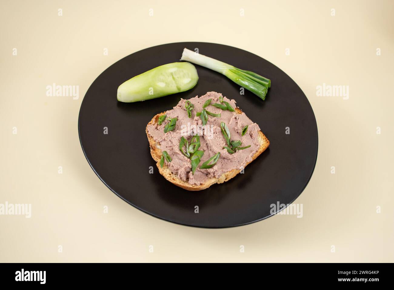 Liver paste pate, on a slice of toasted bread with sprinkled spring ...