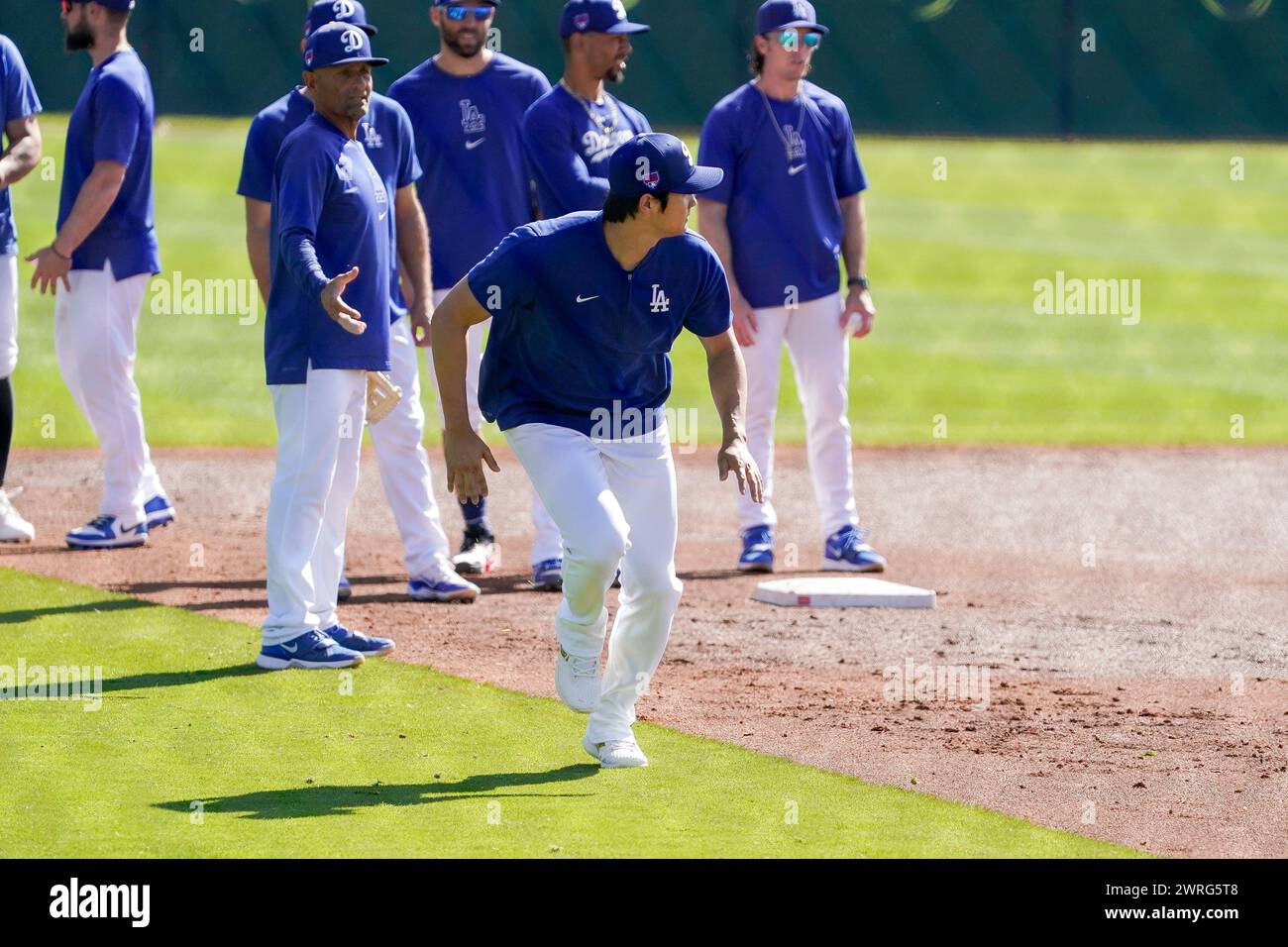 Los Angeles Dodgers Shohei Ohtani, front, participates in spring ...