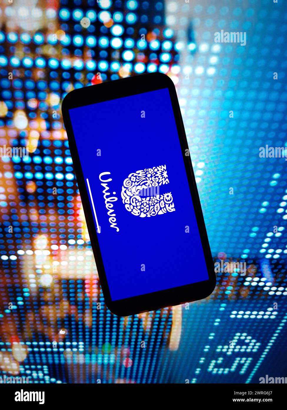 In this photo illustration, the Unilever company logo is seen displayed ...