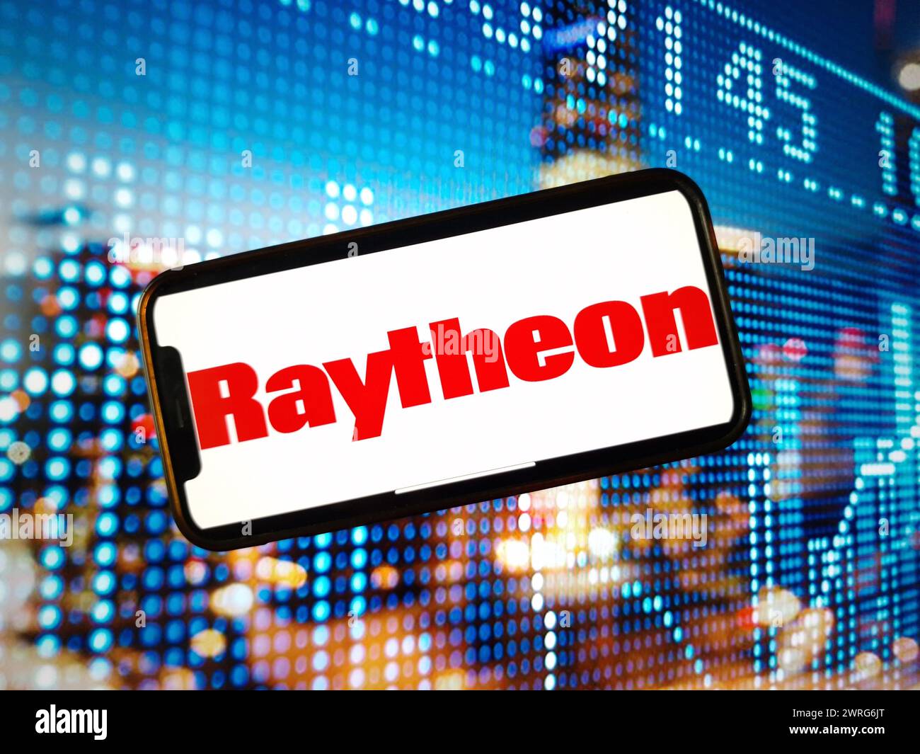 In this photo illustration, the Raytheon Technologies company logo is ...