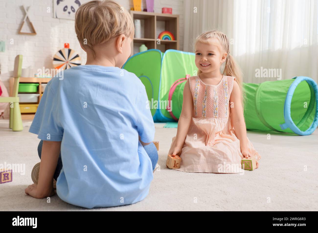 Little children playing with cubes in kindergarten Stock Photo - Alamy
