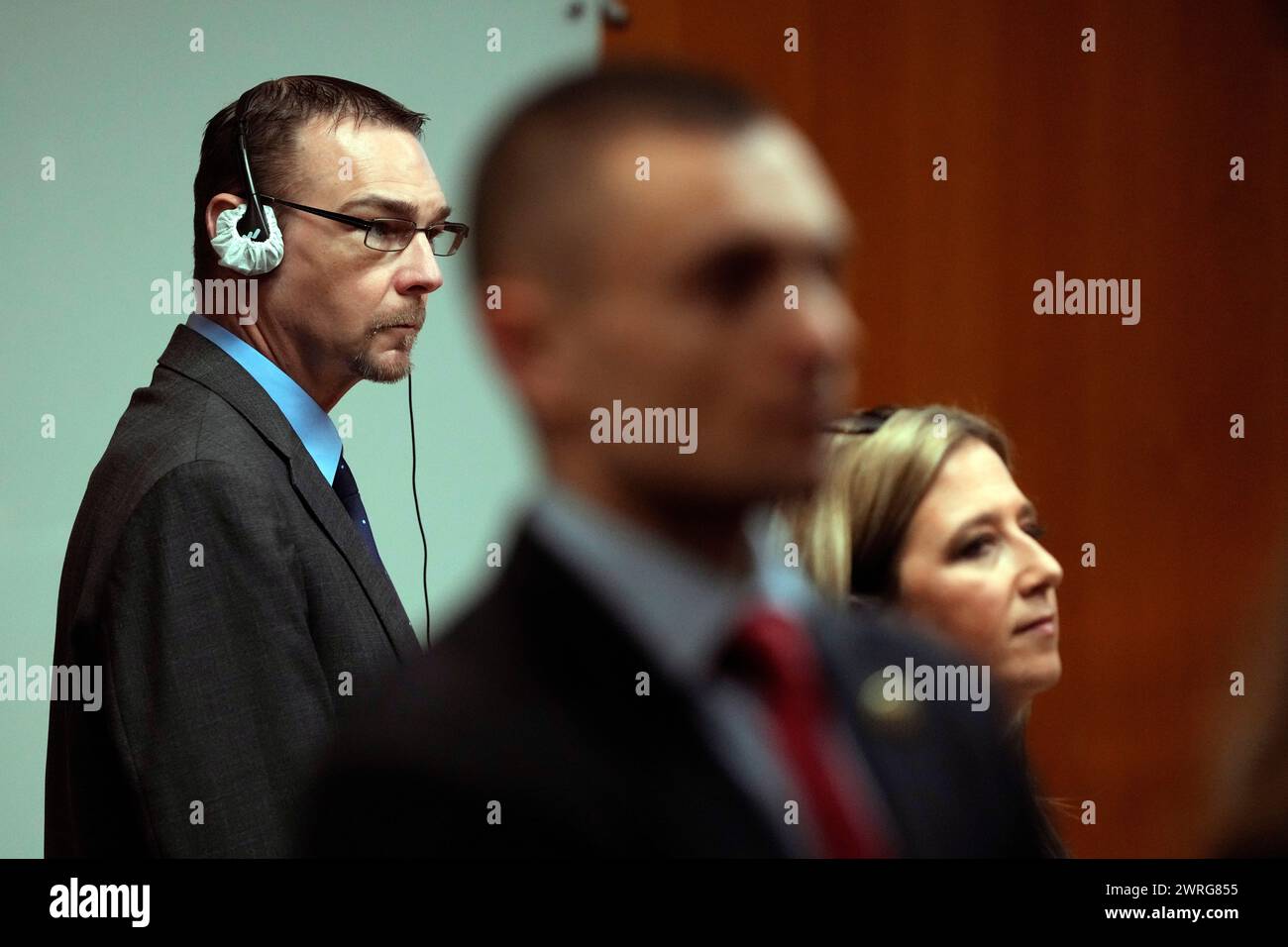 James Crumbley, left, and defense attorney Mariell Lehman, right, stand ...