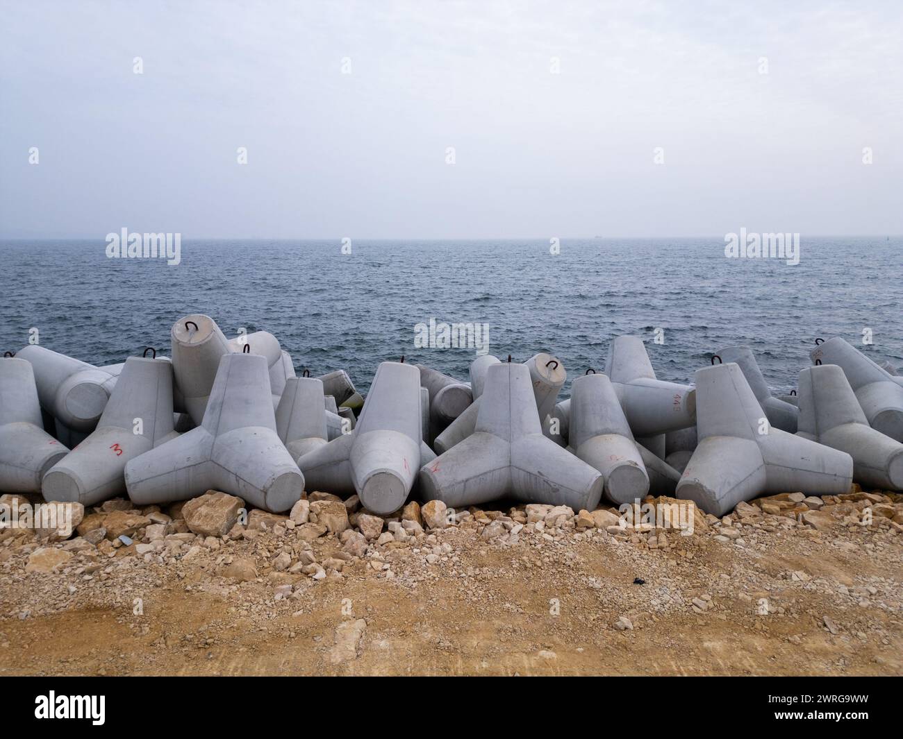 Rows of Concrete Blocks Along Beach Stock Photo - Alamy