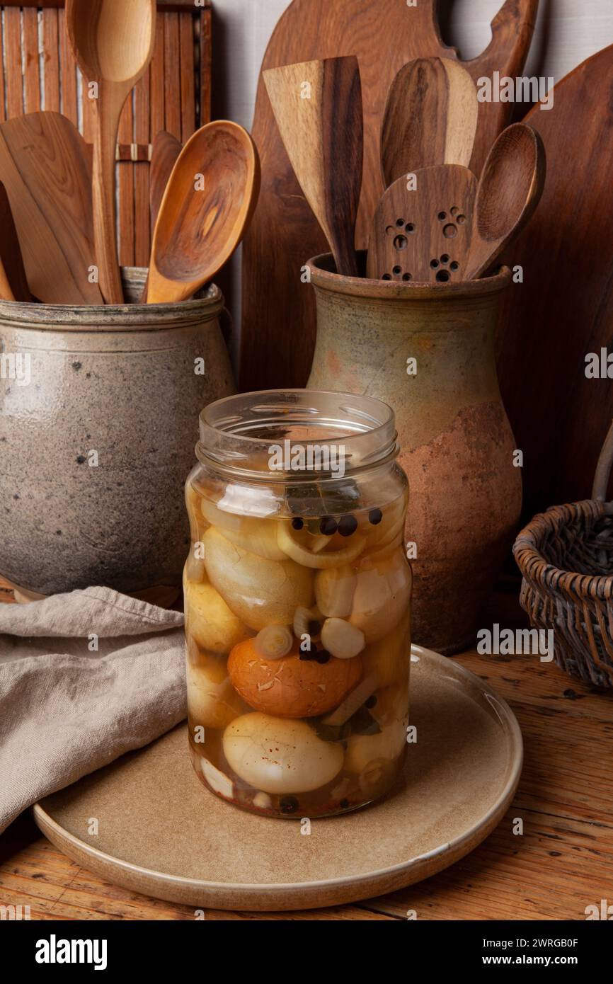 Hard-boiled chicken eggs are pickled in vinegar with spices. .The ...