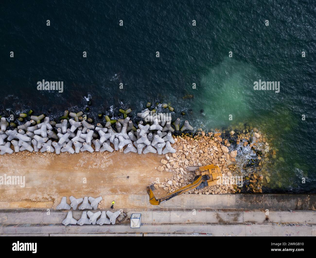 Rows of Concrete Blocks Along Beach Stock Photo - Alamy