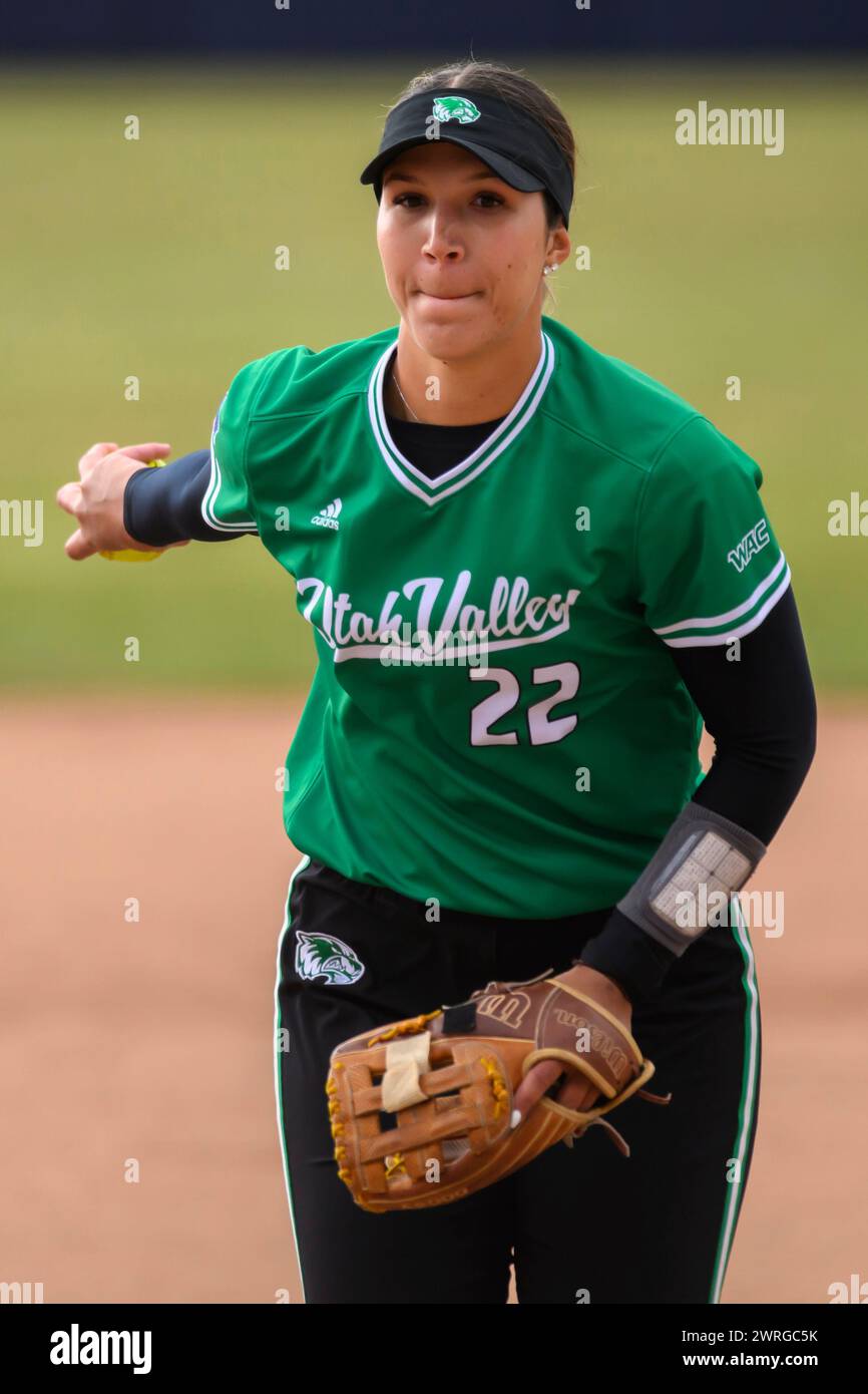 Utah Valley pitcher Halle Morris (22) begins her wind up to throw the ...