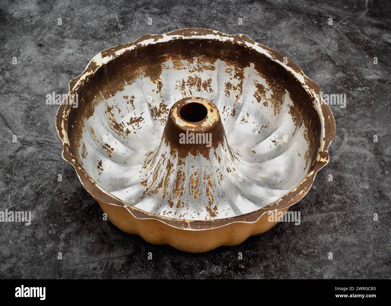 Well used cake tube pan baking bowl Stock Photo - Alamy