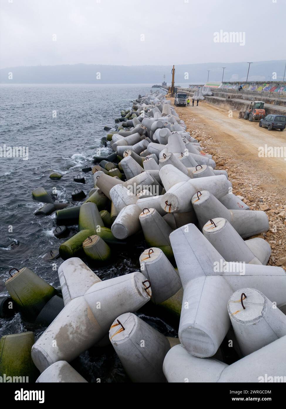 Rows of Concrete Blocks Along Beach Stock Photo - Alamy