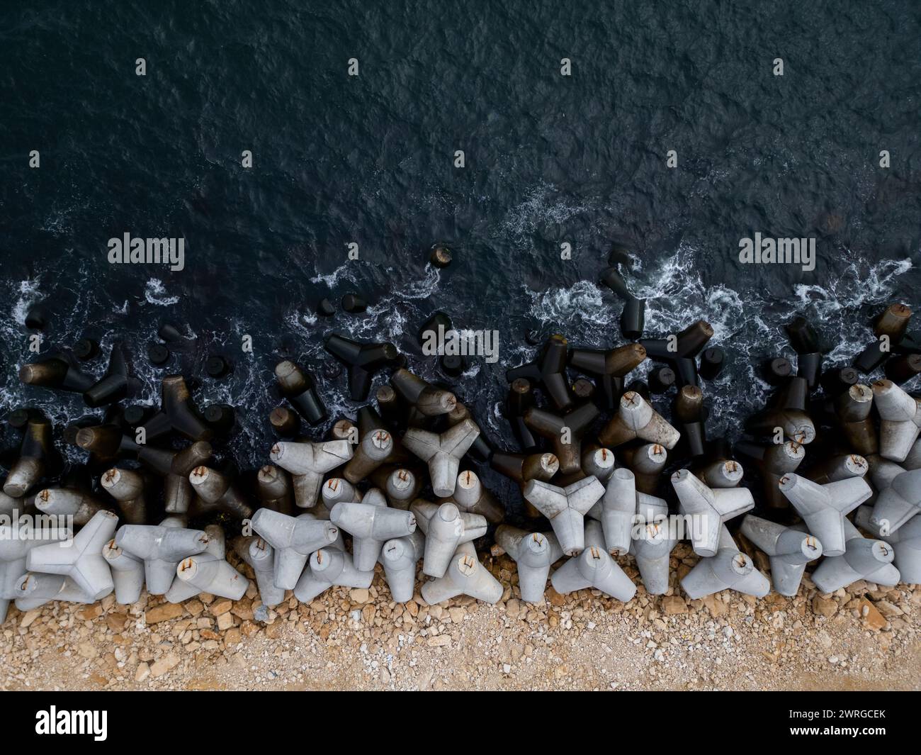 Rows of Concrete Blocks Along Beach Stock Photo - Alamy