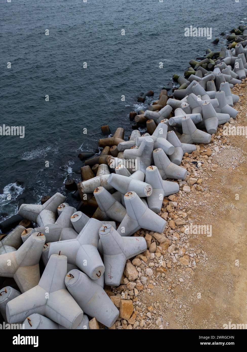 Rows of Concrete Blocks Along Beach Stock Photo - Alamy