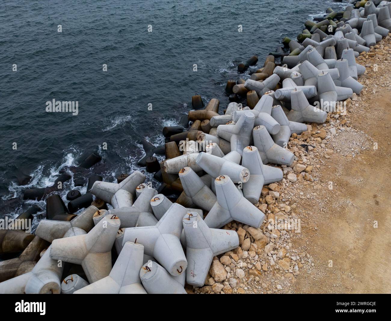 Rows of Concrete Blocks Along Beach Stock Photo - Alamy