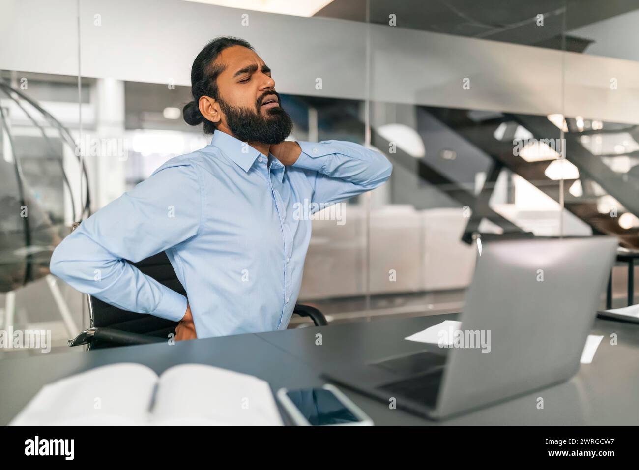 Young businessman back pain working hi-res stock photography and images ...