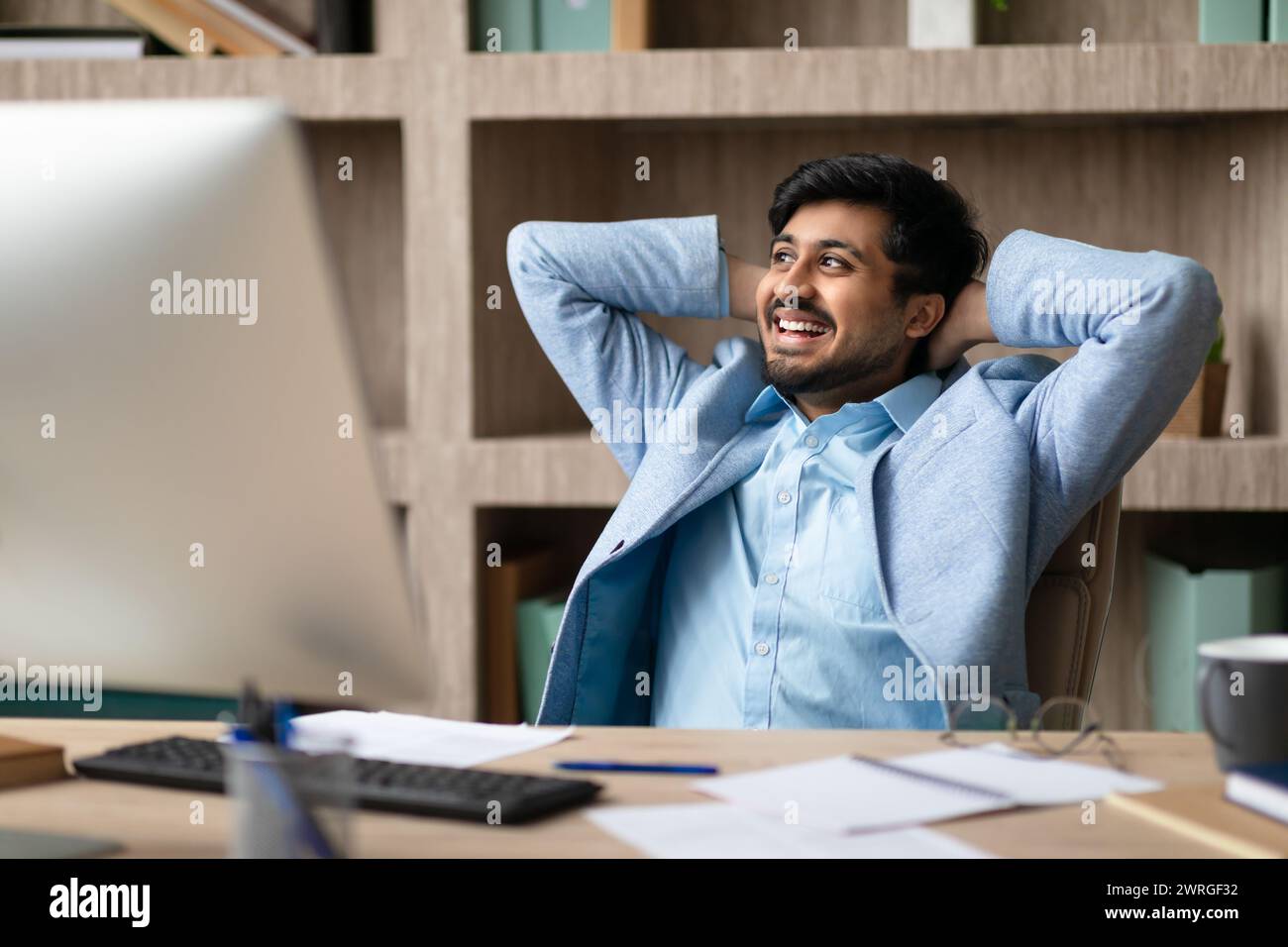 Successful indian business guy resting relaxing in comfortable office ...