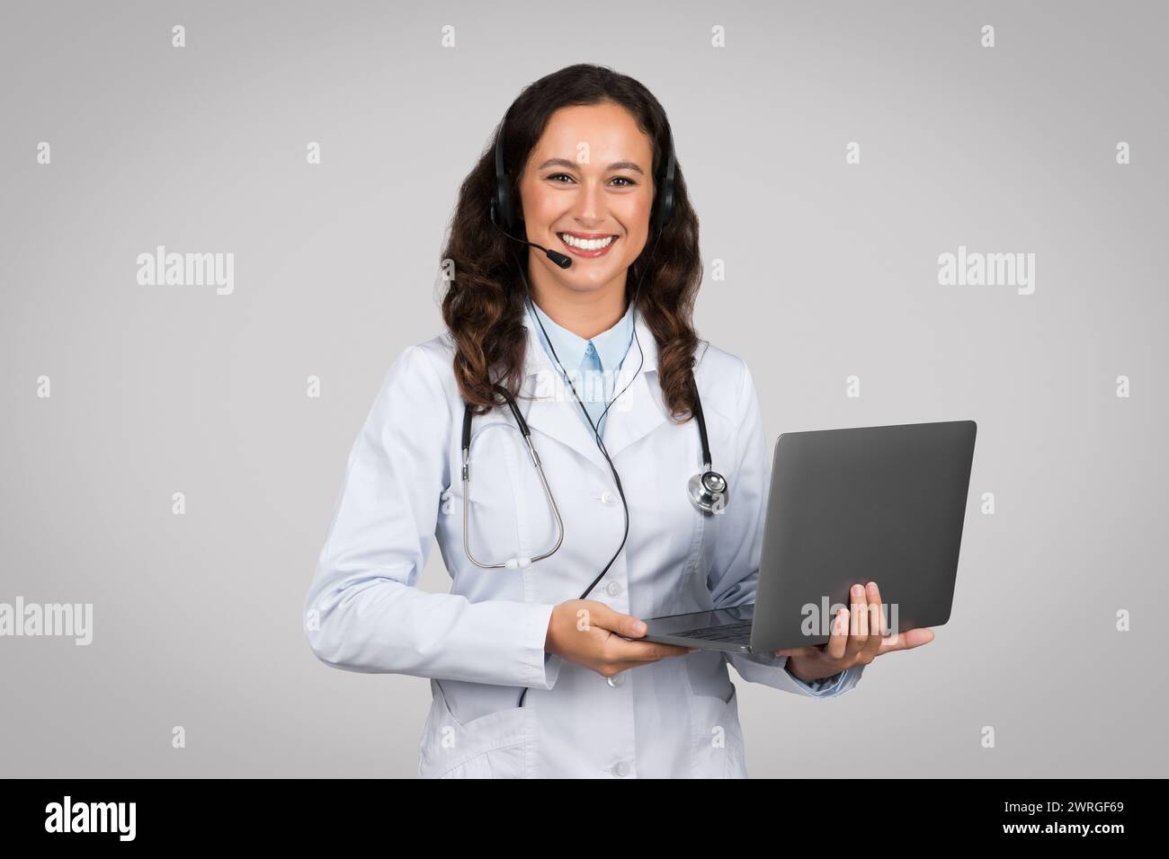 Telemedicine consultations. Young woman doctor conducting remote ...