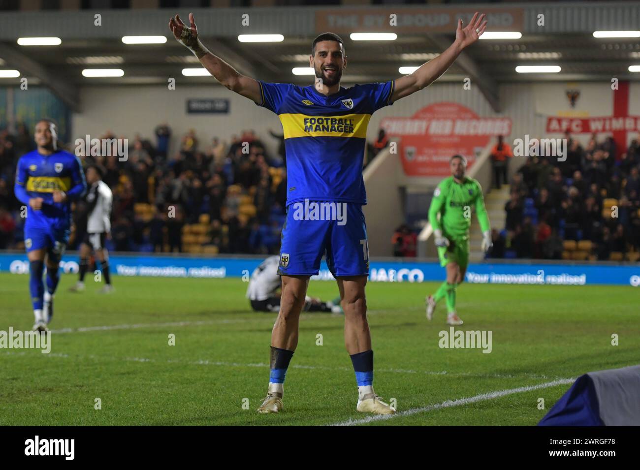 London, England. 12th Mar 2024. Omar Bugiel of AFC Wimbledon celebrates ...
