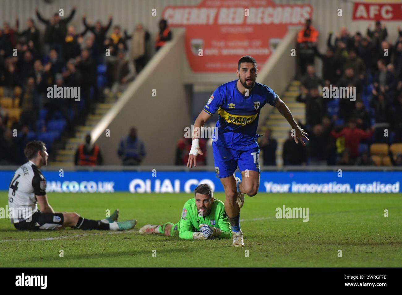 London, England. 12th Mar 2024. Omar Bugiel of AFC Wimbledon celebrates ...