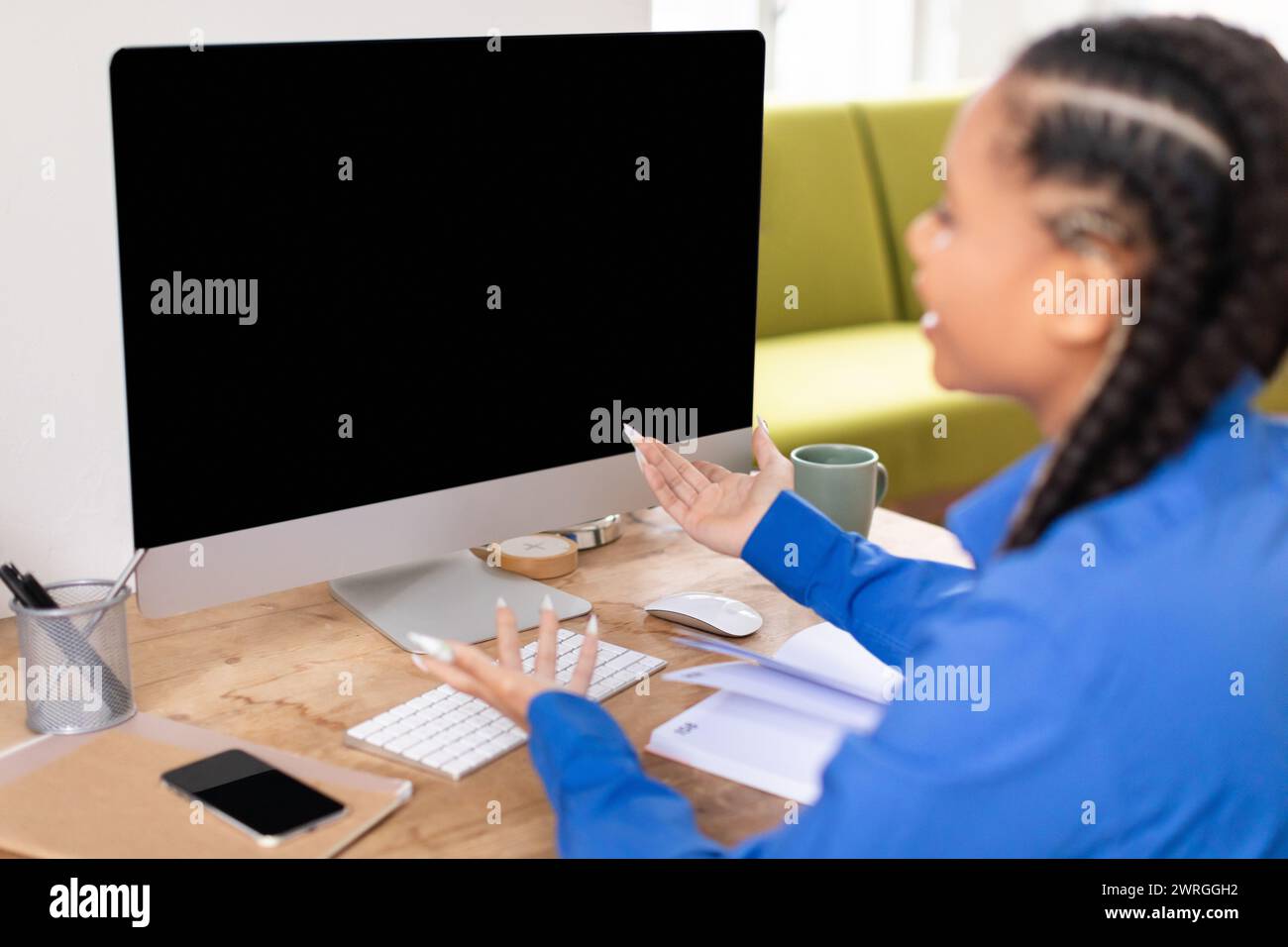 Confused black female student looking at blank computer screen Stock ...