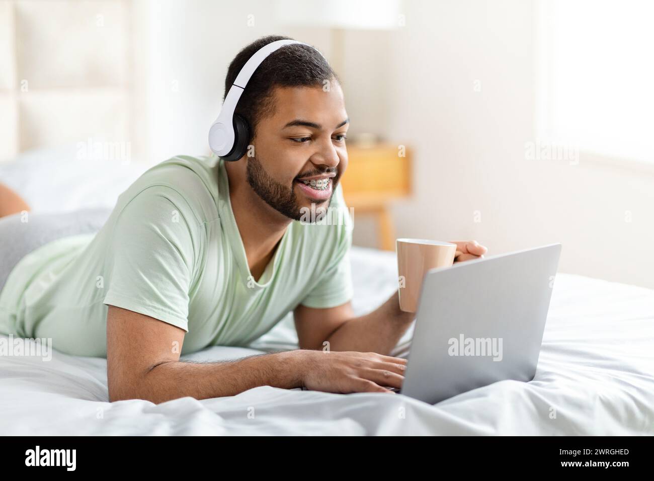 Relaxed black guy watching hi-res stock photography and images - Alamy
