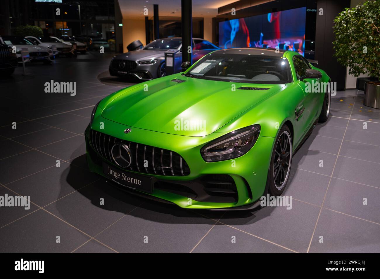 green hybrid Mercedes-AMG GT 63 S E Performance racing car parked in ...