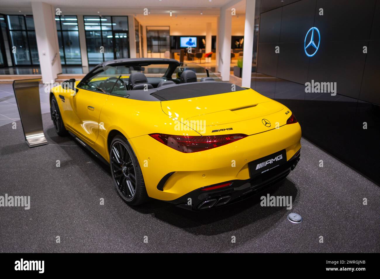 powerful yellow Mercedes AMG SL 63 Roadster racing car parked in ...