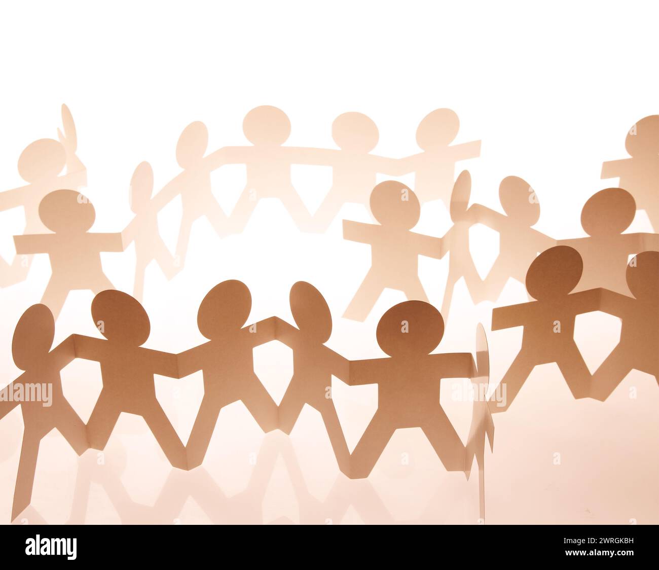 Team of paper chain people united together Stock Photo - Alamy