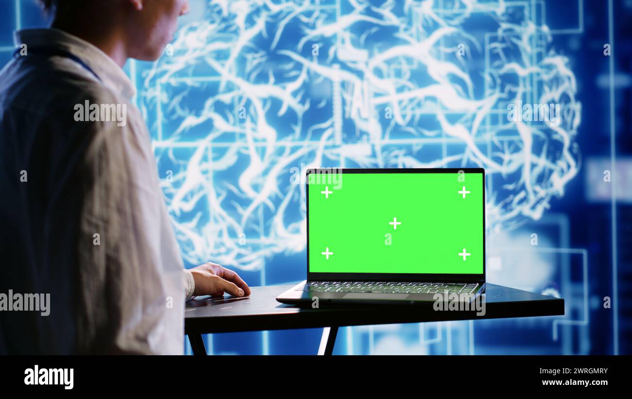 Proficient Worker Using Green Screen Laptop To Implement Artificial Intelligence Parallel