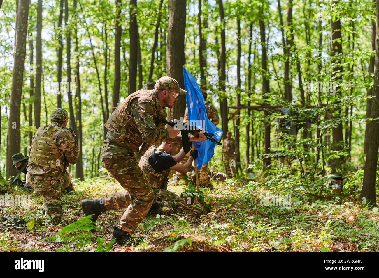 A disciplined and specialized military unit, donned in camouflage ...