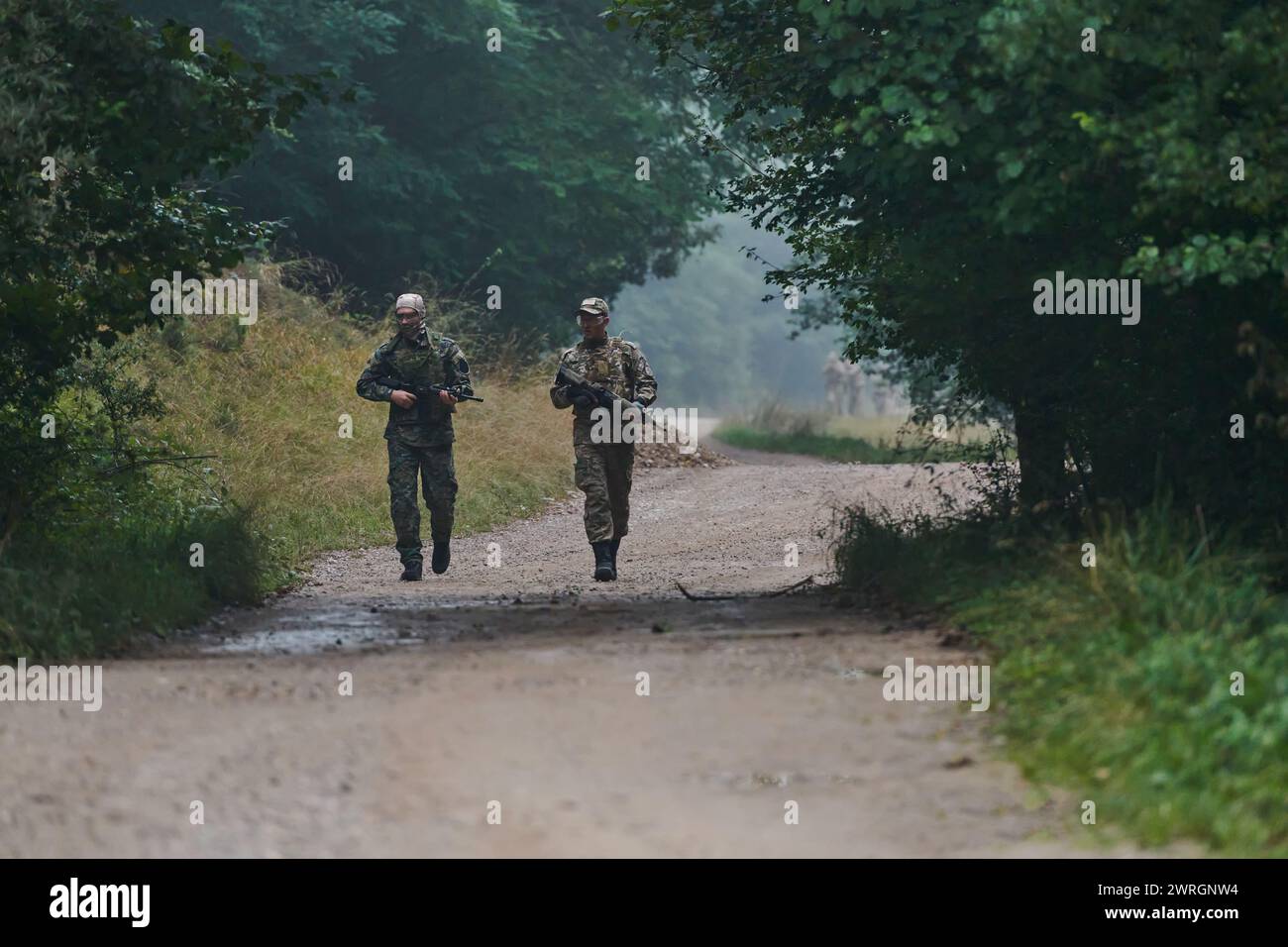 A disciplined and specialized military unit, donned in camouflage ...