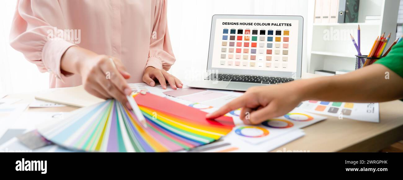 Cropped imaged of professional interior designers choose appropriate ...