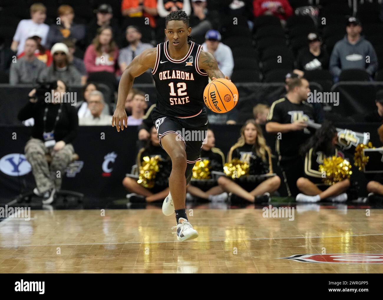 MAR 12 2024: Oklahoma State Cowboys guard Javon Small (12) brings the ...