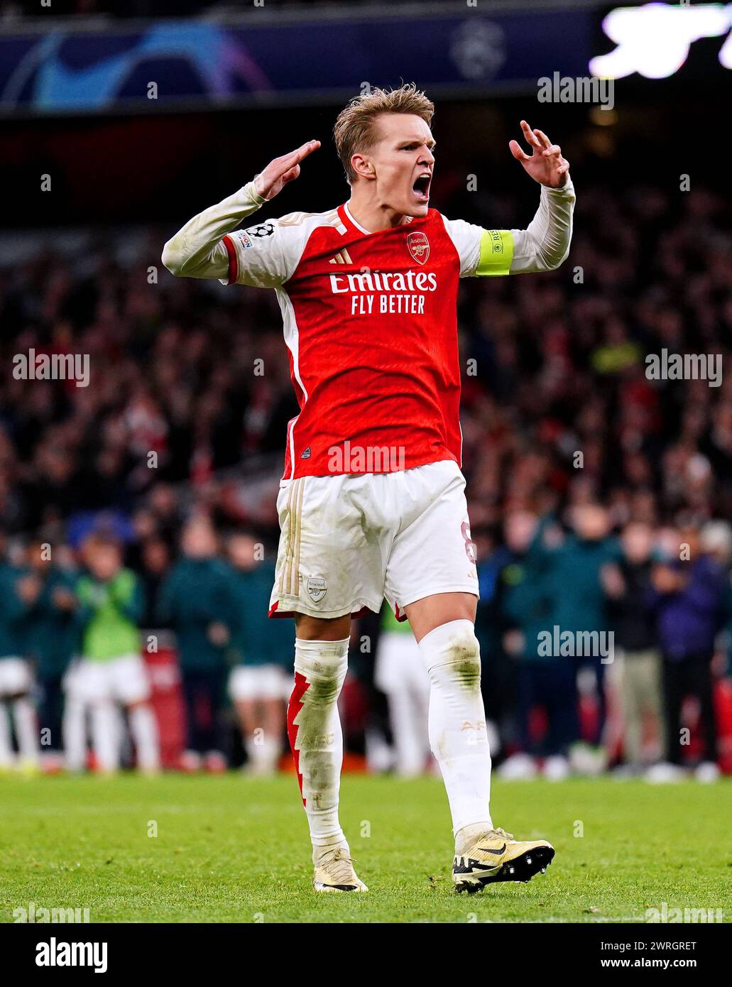 Arsenal's Martin Odegaard celebrates after scoring the first penalty of ...