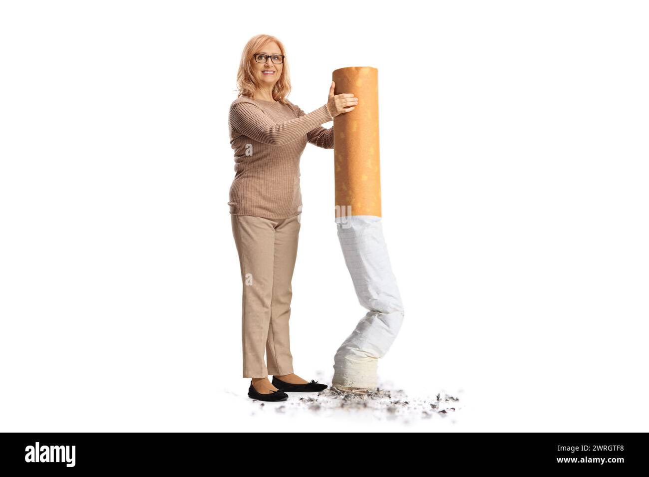 Middle aged woman putting off a big cigarette and smiling isolated on ...