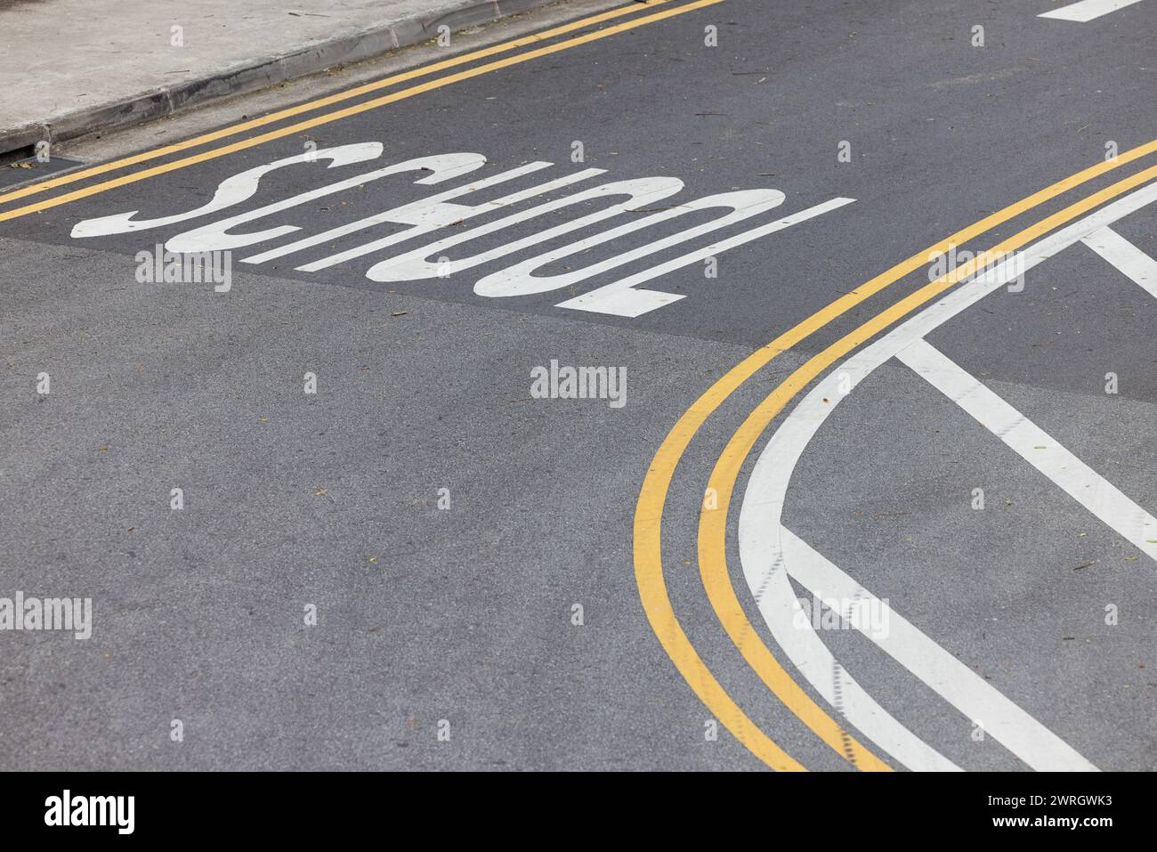 On the road near the school, the markings have been updated. Yellow and ...