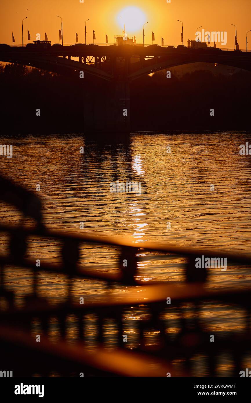 Golden Bridge Sunset: Radiant sun, tranquil water, and silhouetted ...