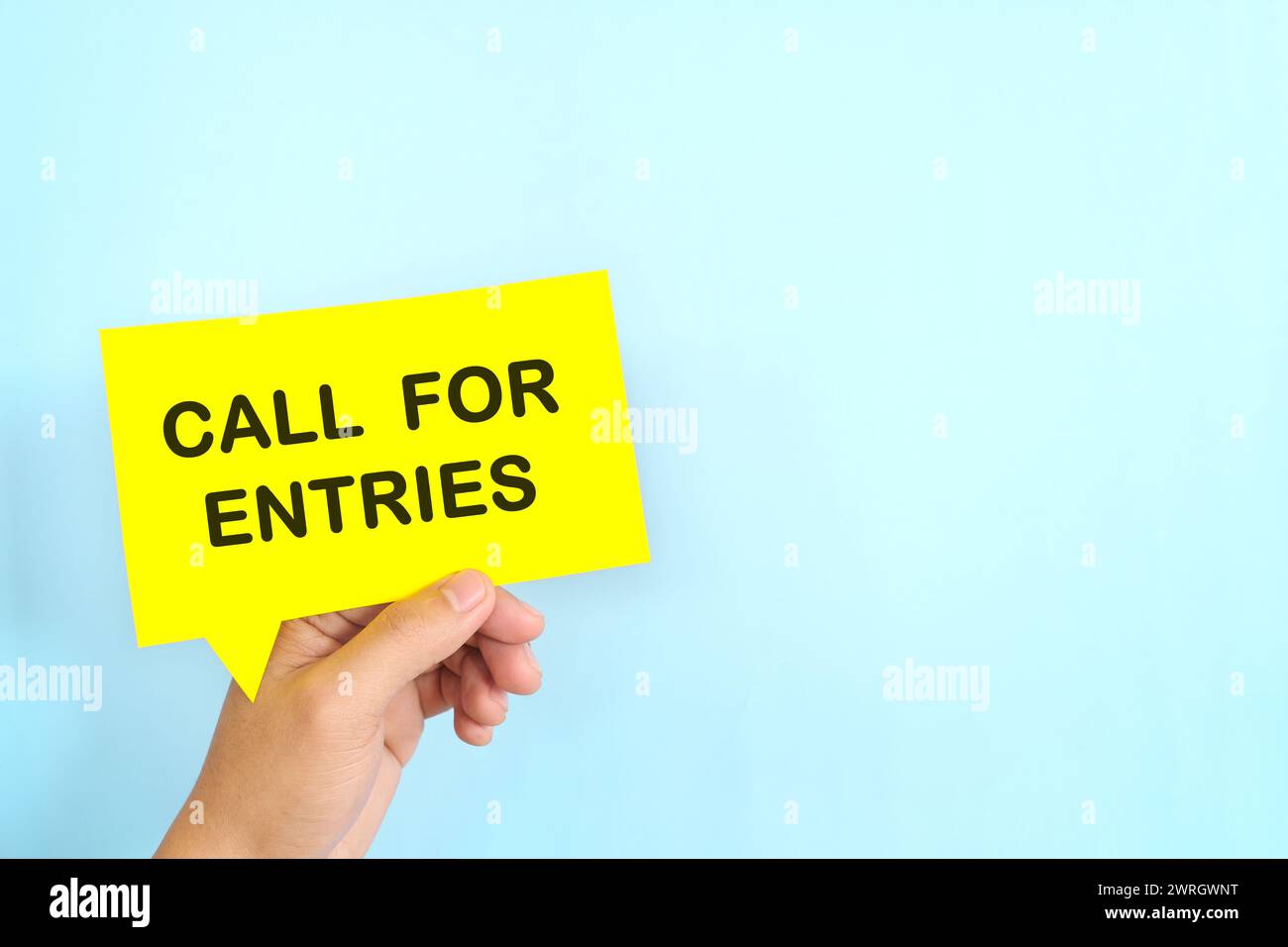 Human hand holding speech bubble with written phrase Call for Entries ...