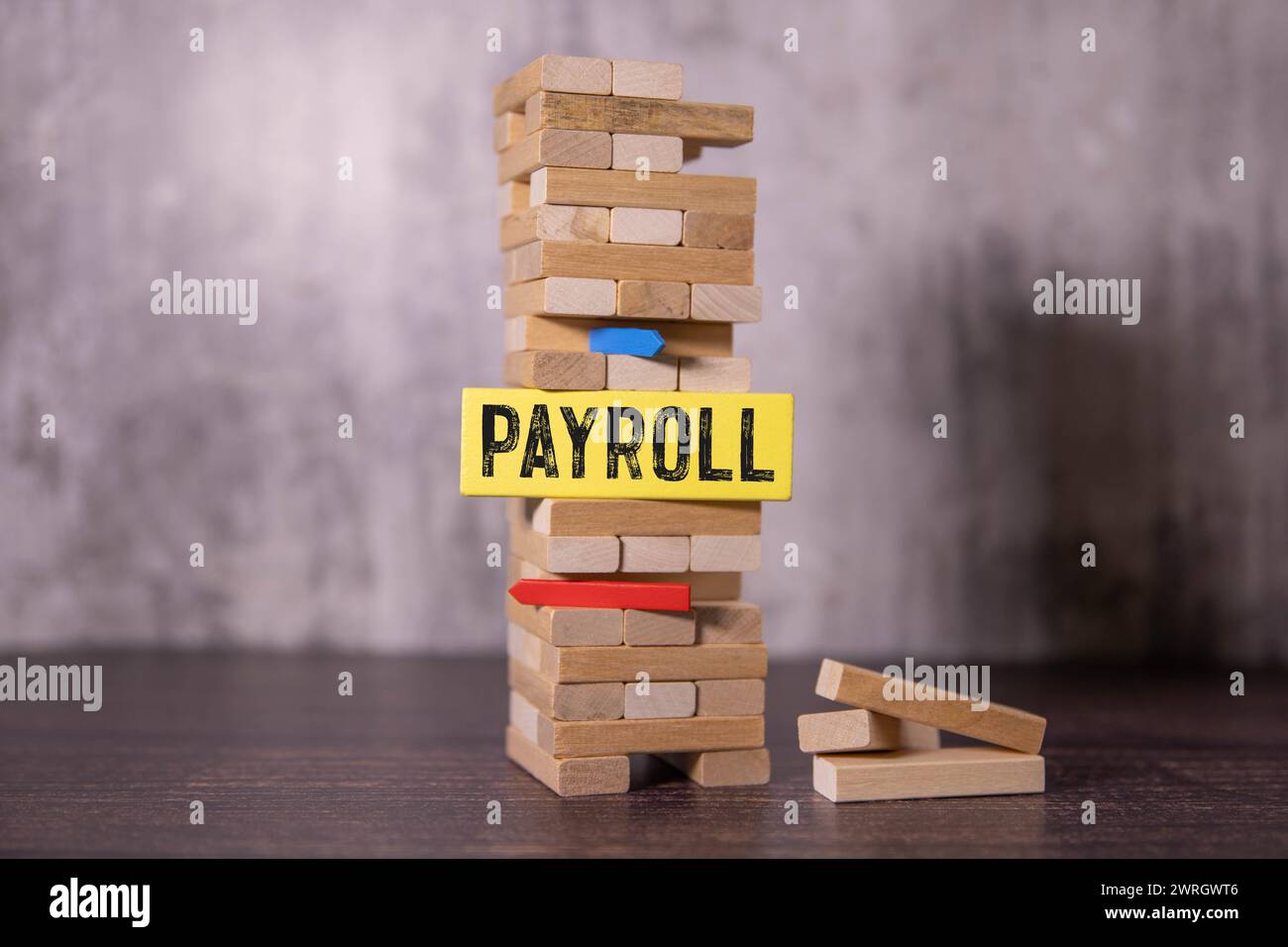 payroll. Wooden letters on dark background Stock Photo - Alamy