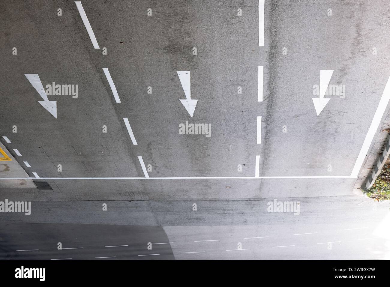 Asphalt road with arrow markings Stock Photo - Alamy
