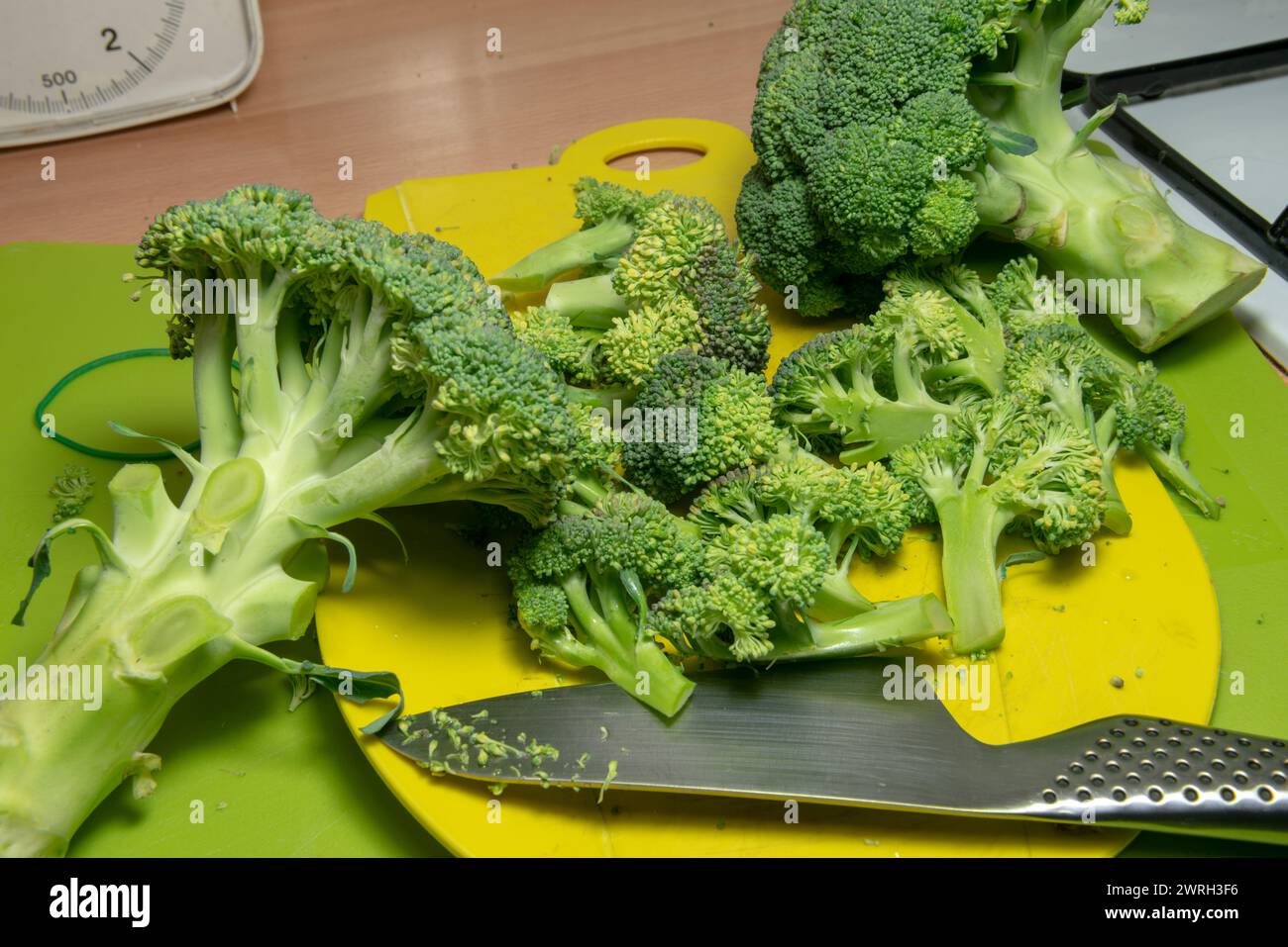 Broccoli in the kitchen on the cutting board, bright green, nutritious ...