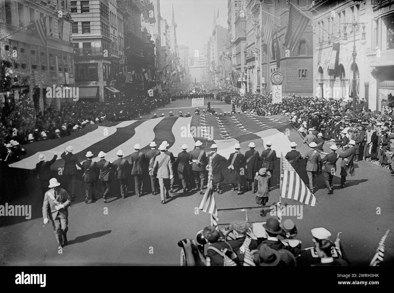 Liberty Parade, 1917 or 1918. Men with large American flag marching in ...