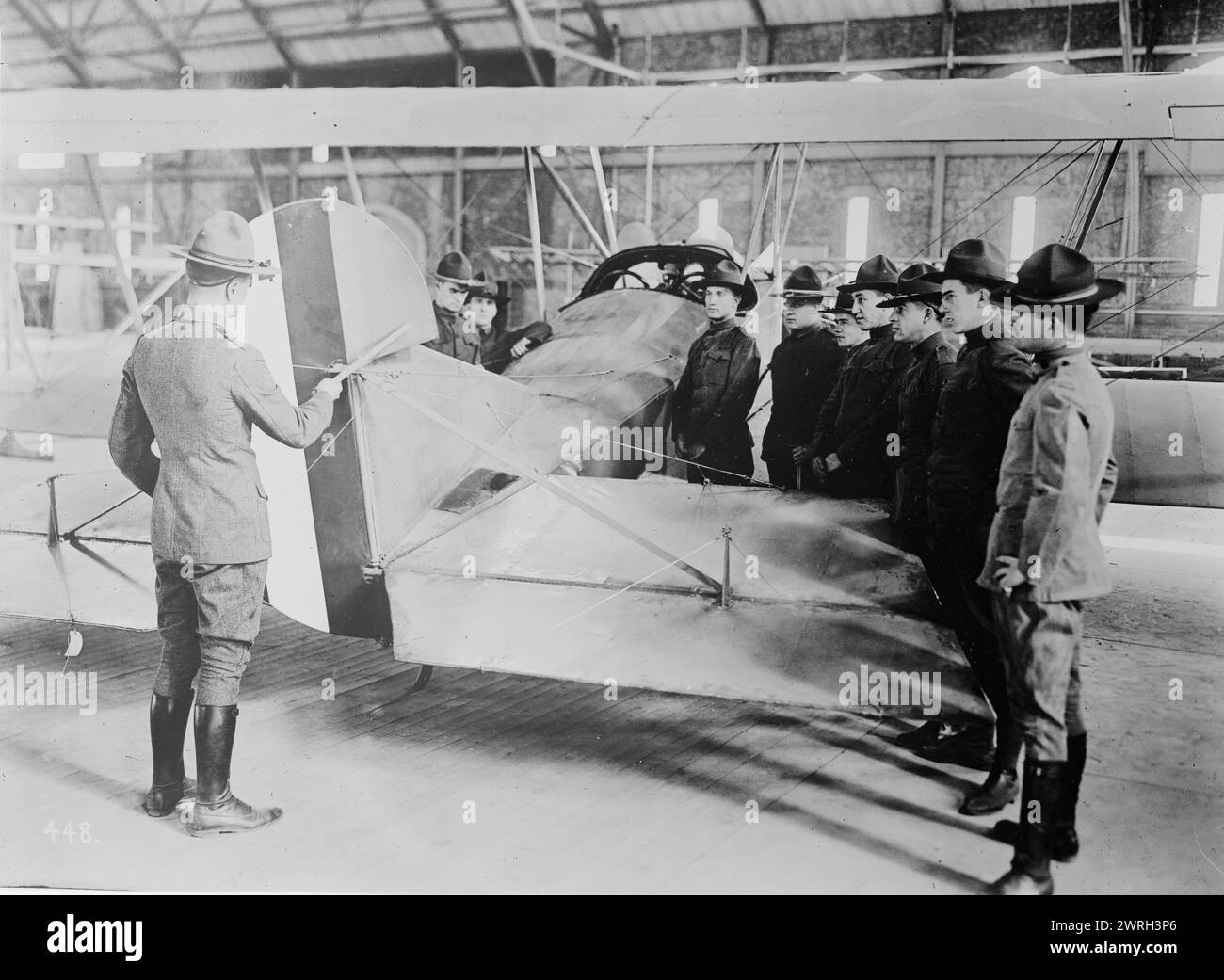 Studying aeroplane [i.e. airplane] rudder, 1917 or 1918. The instructor ...