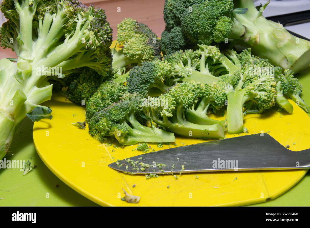 Broccoli in the kitchen on the cutting board, bright green, nutritious ...