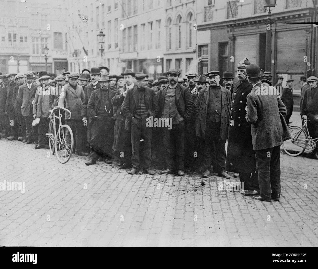 Refugees returned to Antwerp, 1914. Men in street in Antwerp, Belgium ...