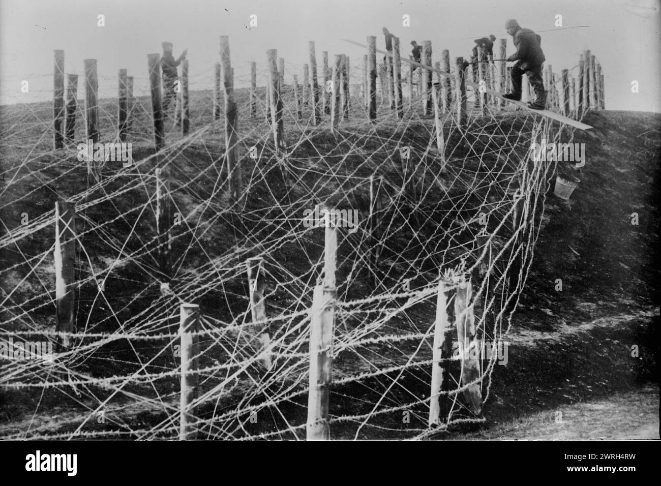 Germans fixing barbed wire tangle, between c1914 and c1915. German ...