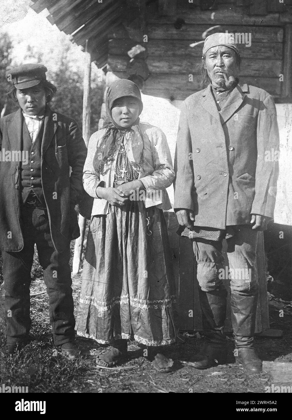 Two Tungus men and a woman with a cross on her chest, 1920-1939. From a ...