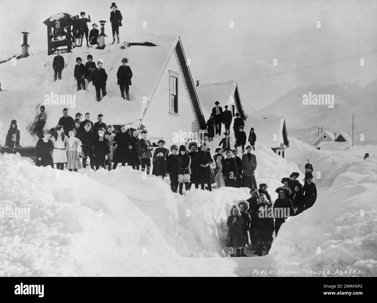 Public school, c1910. Group portrait of students around snow-covered ...