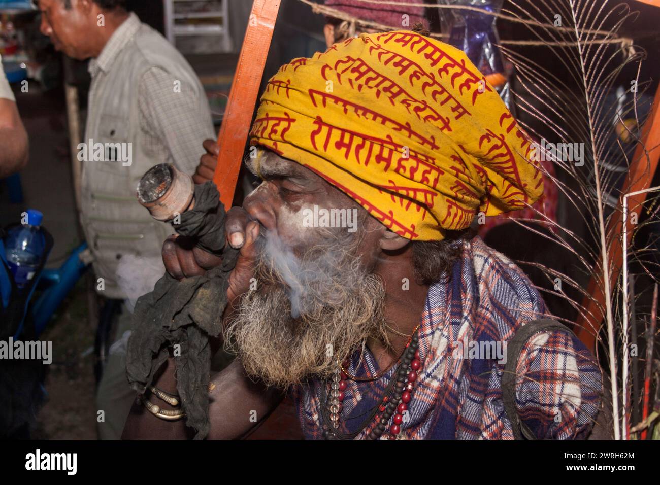 Pokhara, Nepal - NOVEMBER 04, 2006. Hindu sadhu smokes a hash pipe ...