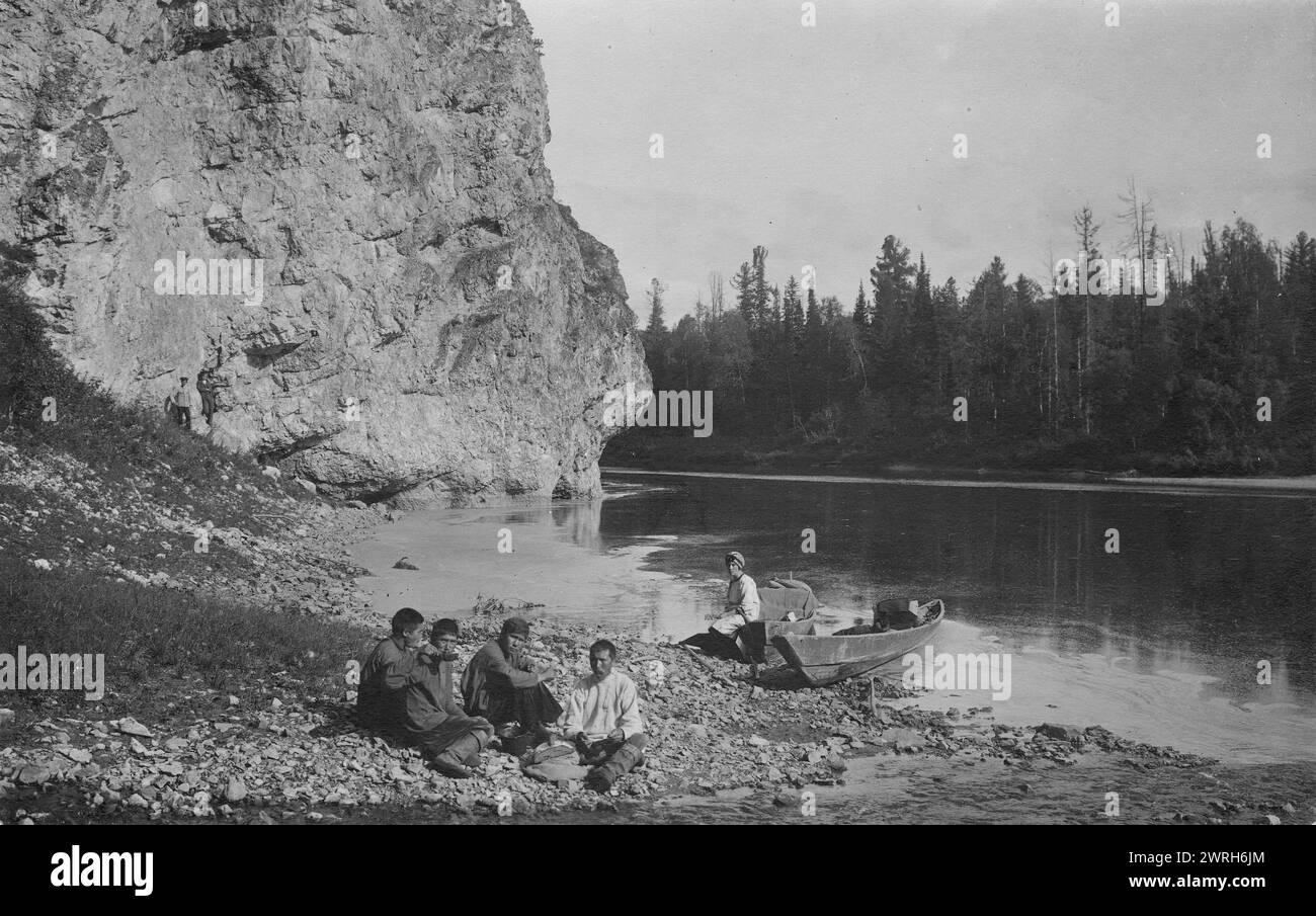 Members of the Expedition at Dinner on the Shore of the Mrassu River ...