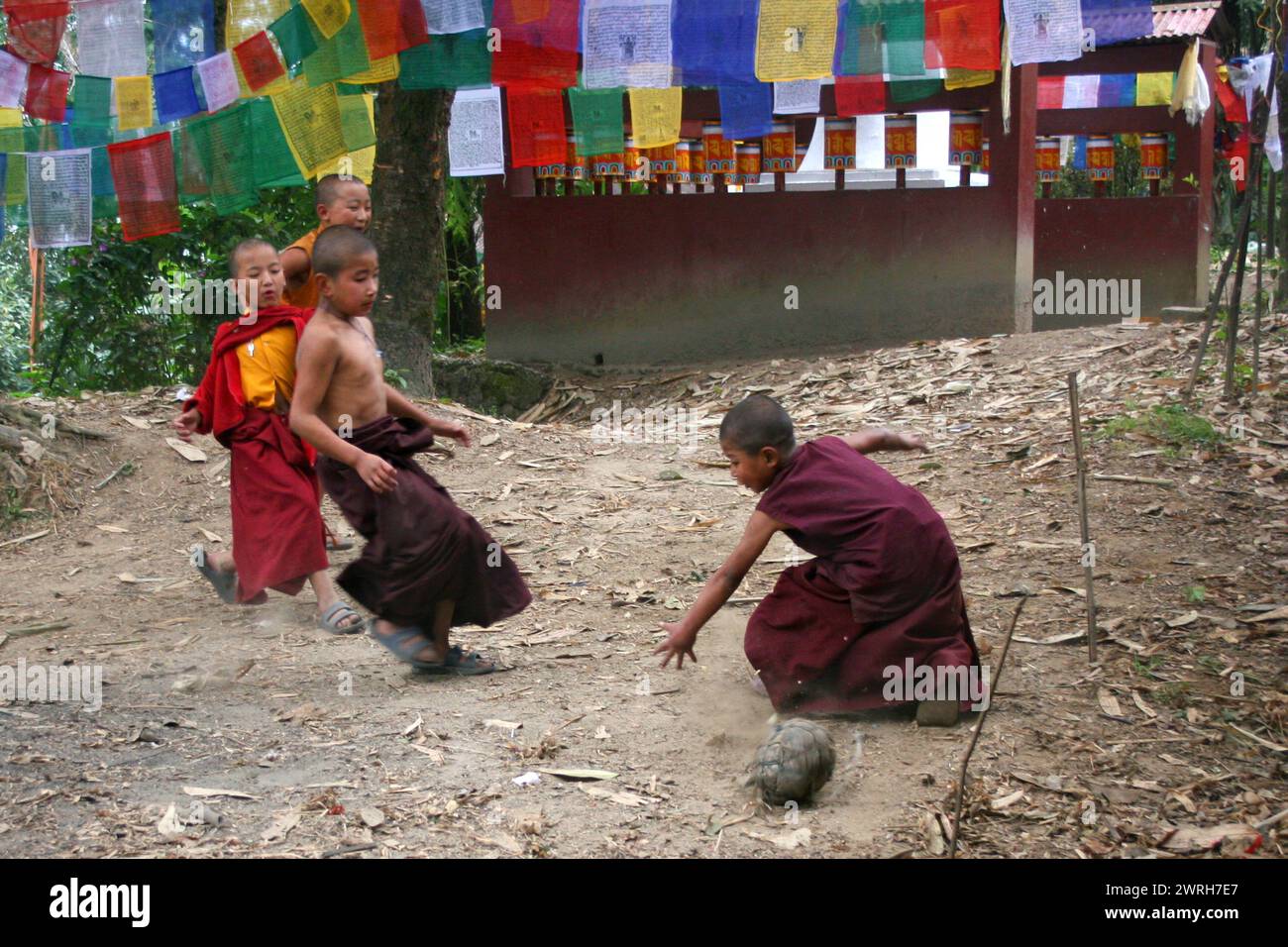GANGTOK, SIKKIM, INDIA - NOVEMBER 11, 2006: Little buddhist monks play ...