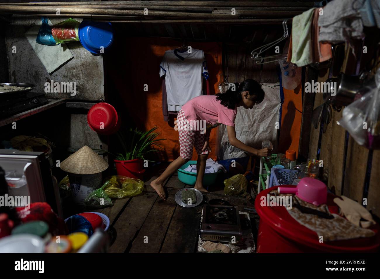 Do Bao Tran, who lives on a houseboat with her twin brother and their ...
